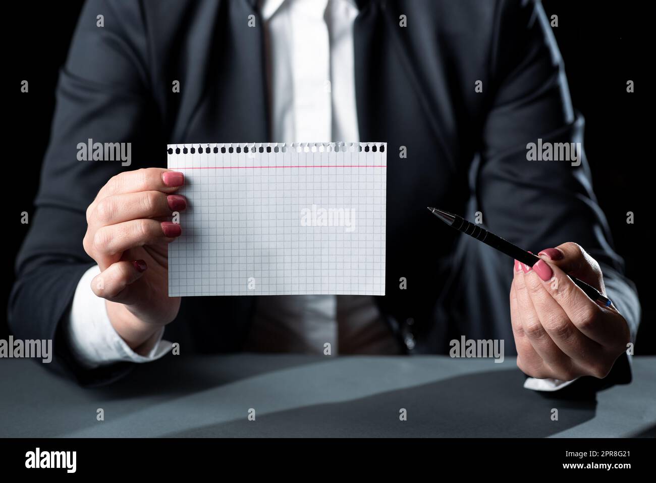 Businesswoman Holding Note With Important Message And Pointing With Pen ...