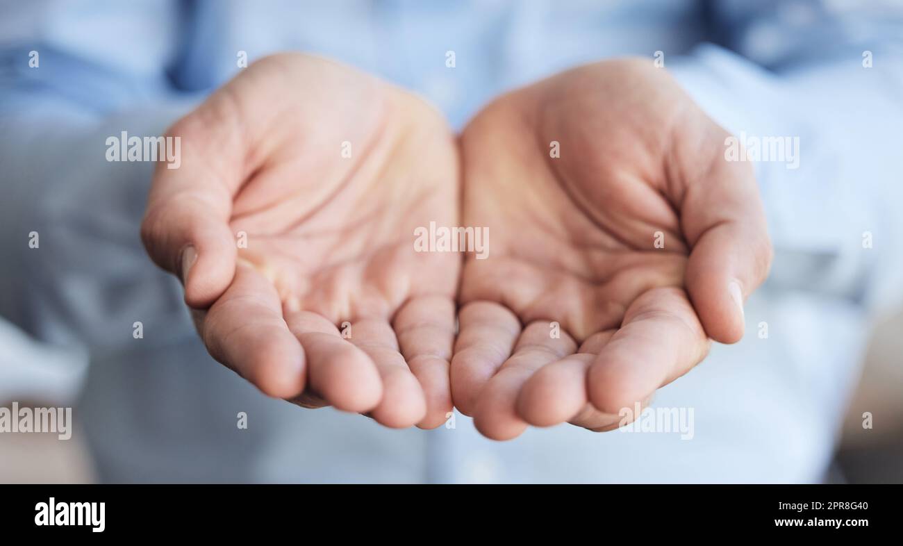 Every bit counts. Shot of an unrecognizable businesspeople holding out ...