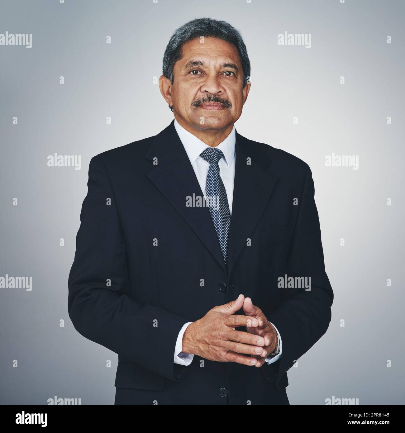 The boss is here. Studio portrait of a mature businessman posing ...