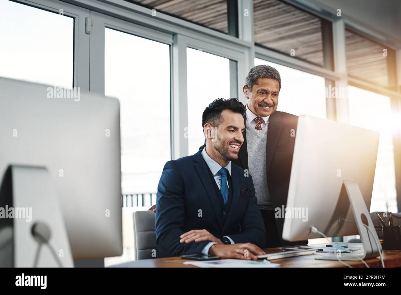 The boss is happy with his work. colleagues working together in a ...