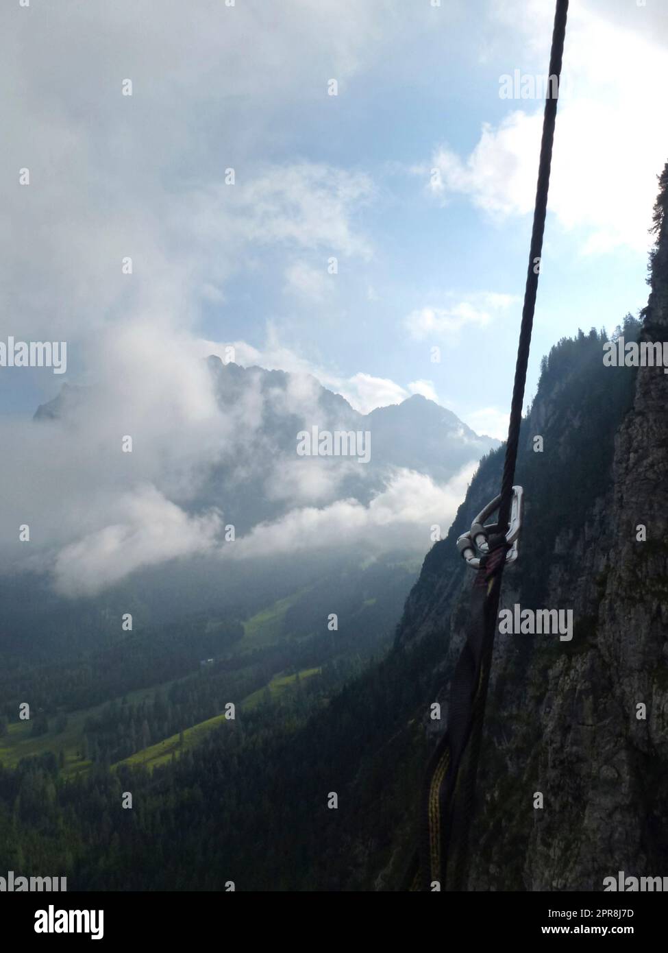 Climber at Seebenklettersteig via ferrata, Tyrol, Austria in summertime ...