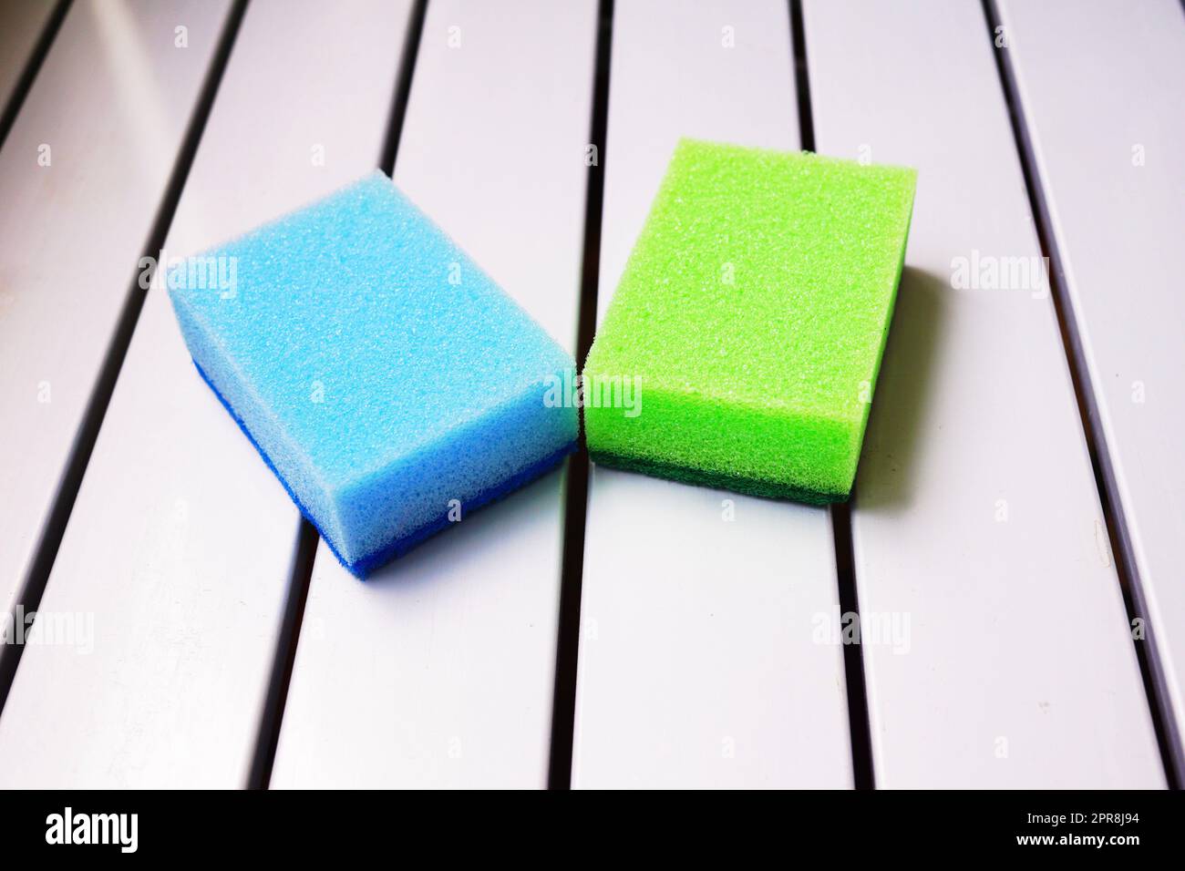 Set for cleaning.Two green and blue sponge Stock Photo - Alamy