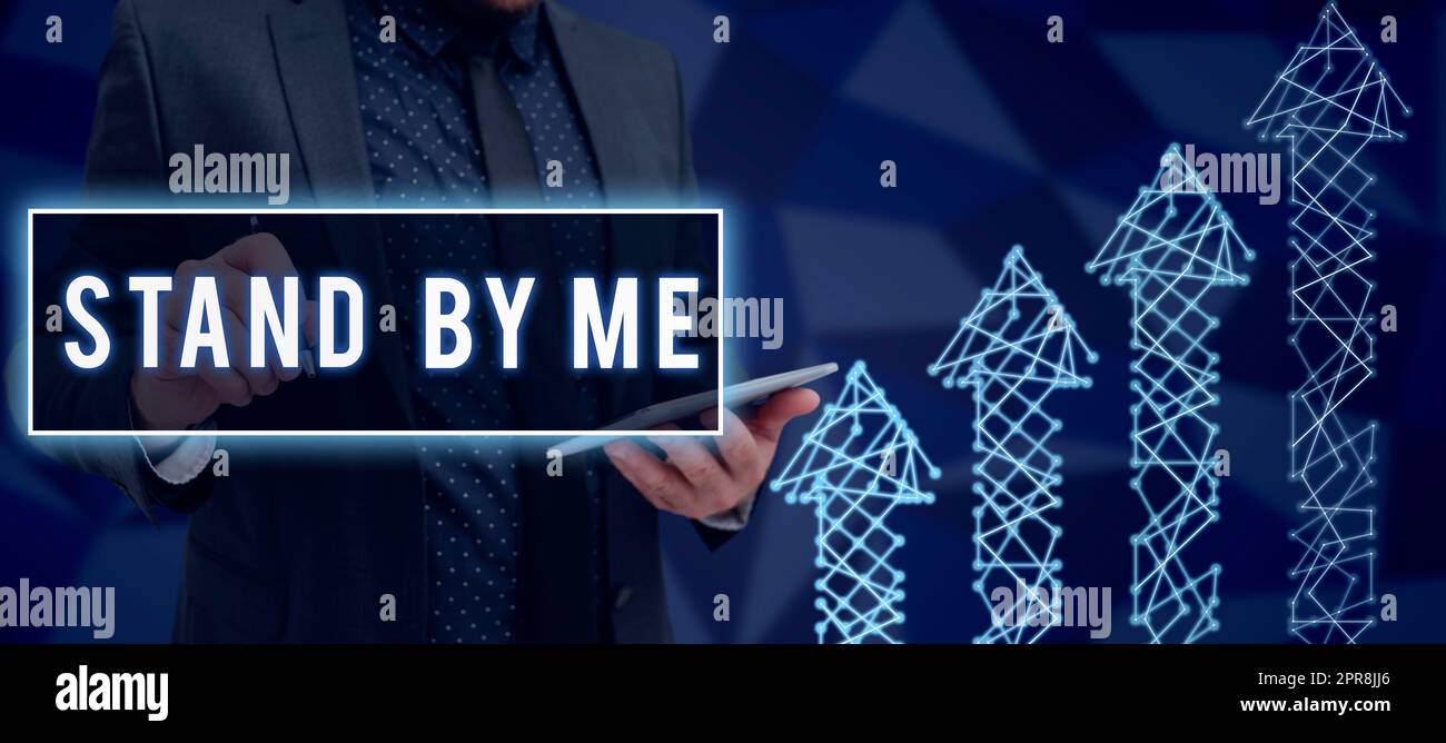 Hand writing sign Stand By Me. Word Written on Be always around myself ...