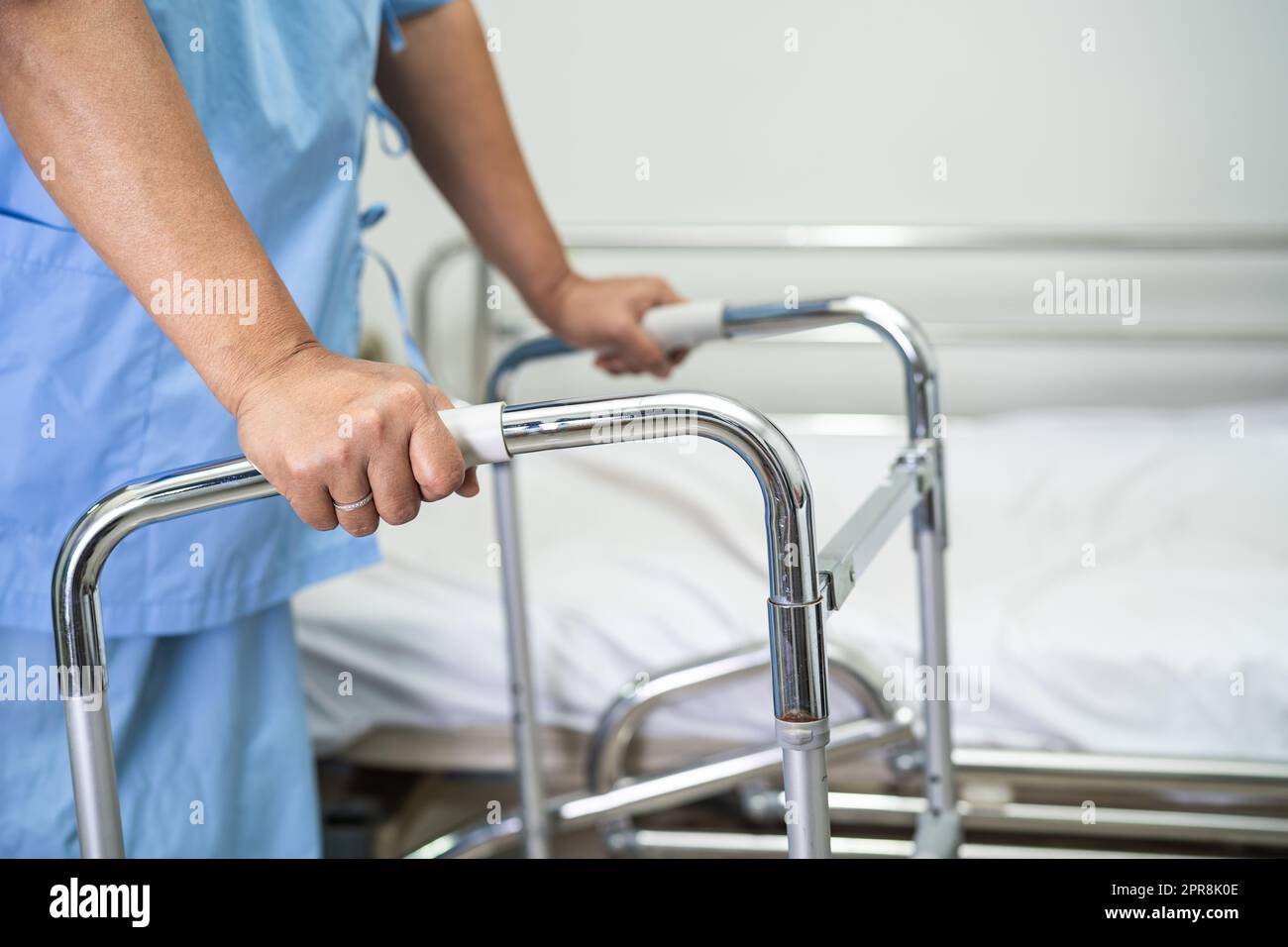 Asian lady woman patient walk with walker at nursing hospital ward ...