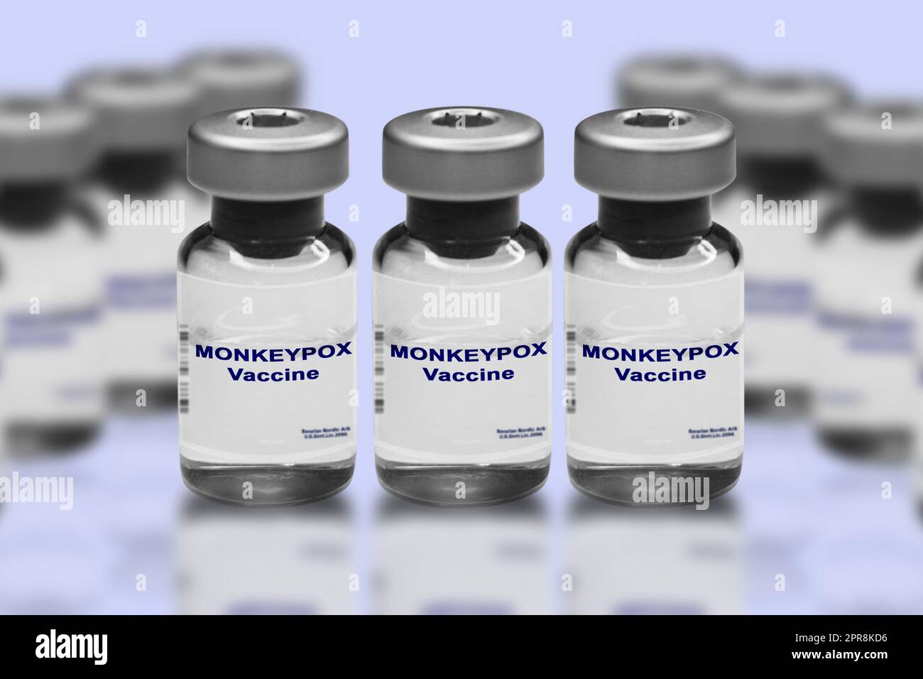 Monkeypox vaccine close-up on a light mirror background. In the ...