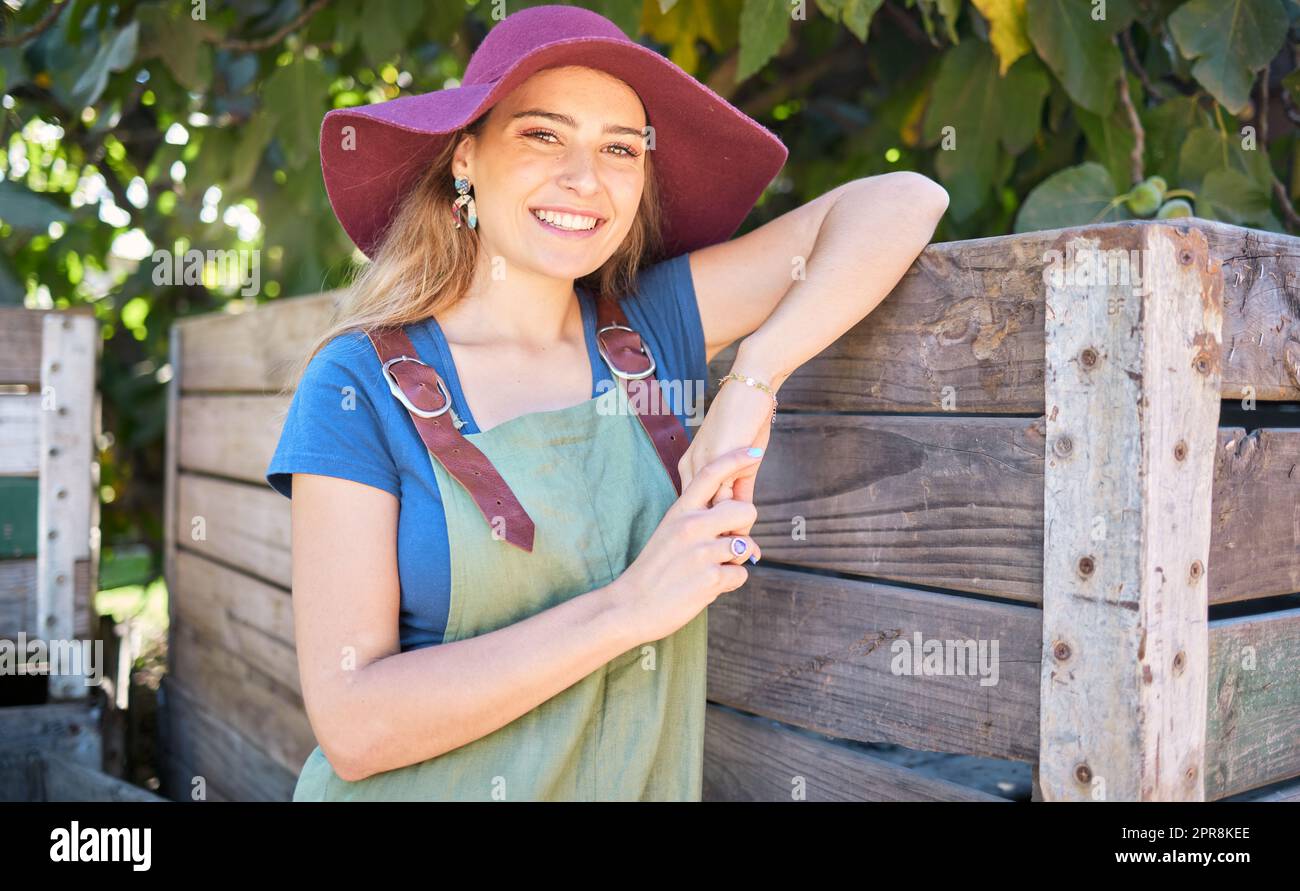 Portrait of a happy woman on a farm. Young farmer on a organic ...