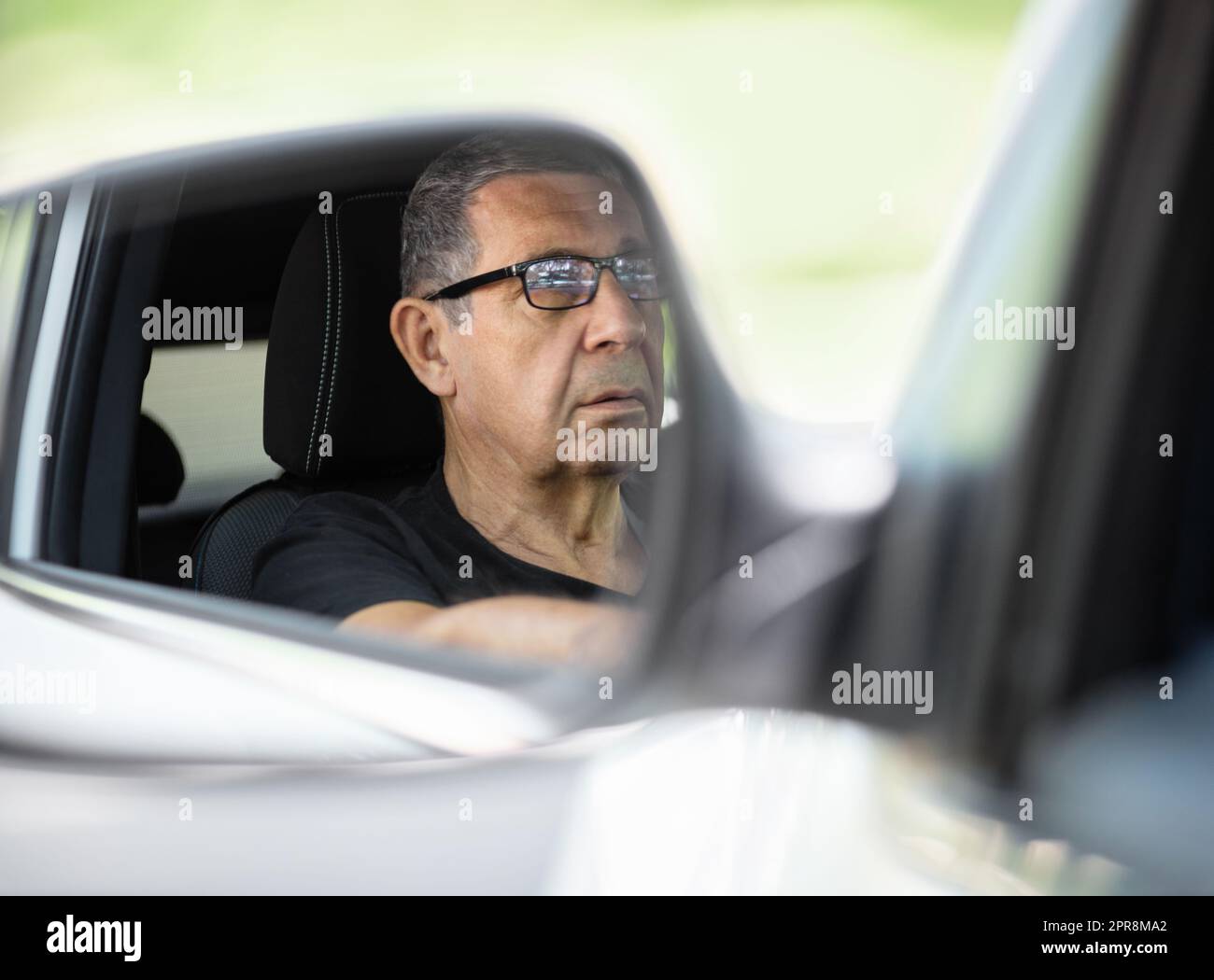 Senior in his 70s driving a car Stock Photo - Alamy