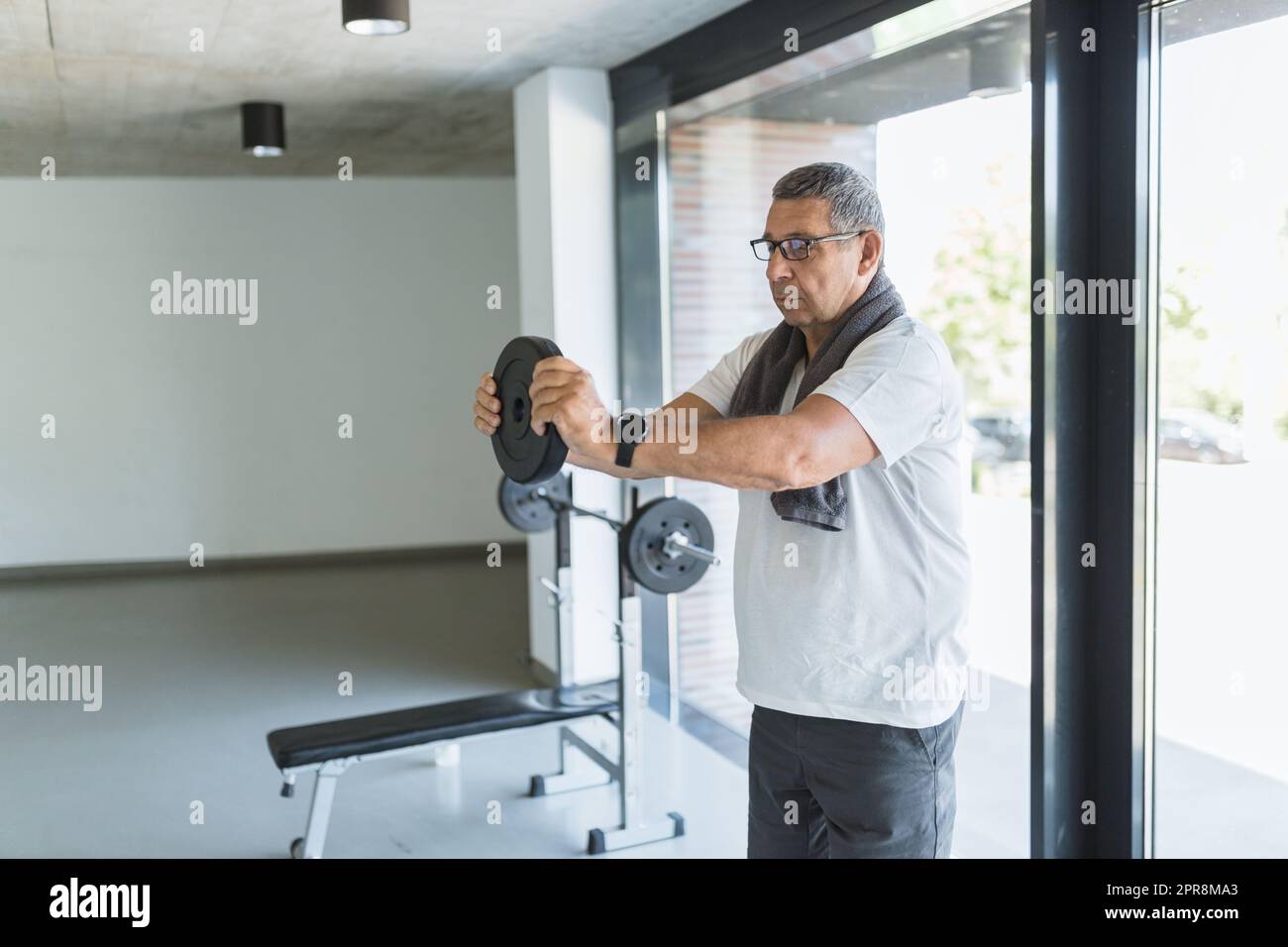Active senior exercising in a gym Stock Photo - Alamy