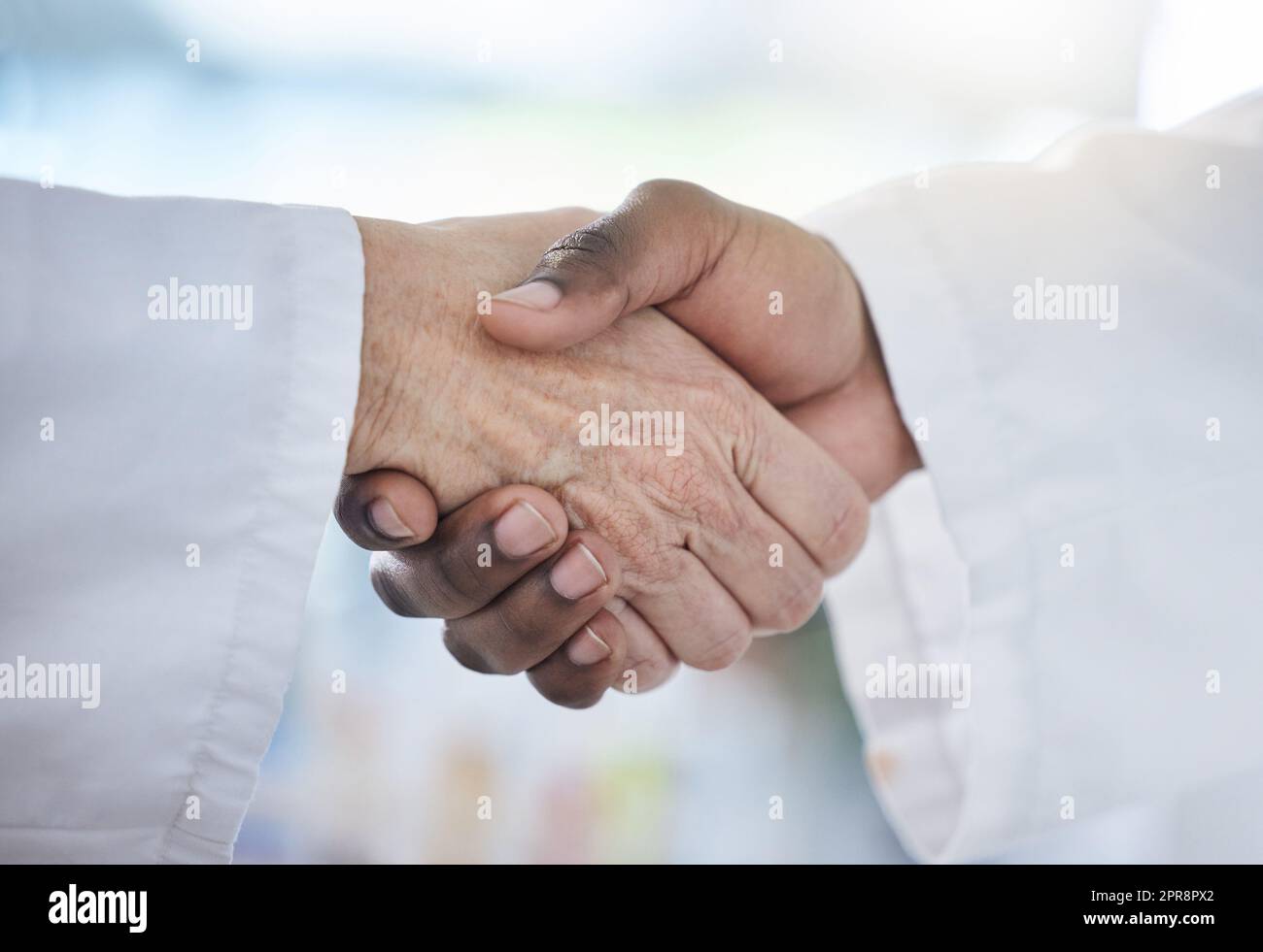 Two doctors shaking hands in a hospital hi-res stock photography and ...