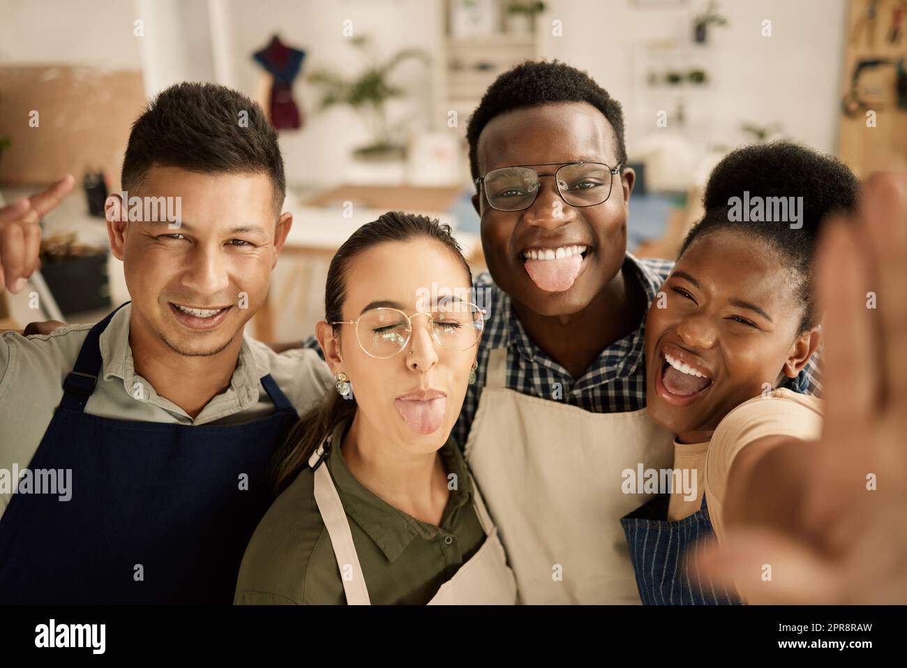 Diverse businesspeople being silly in a selfie. Group of fashion ...