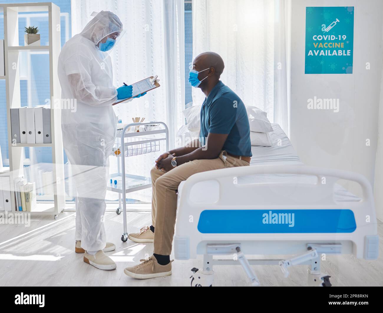 Doctor writing in patient chart hi-res stock photography and images - Alamy