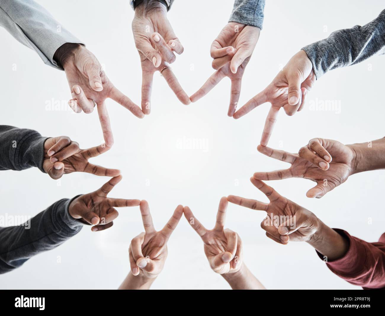 People huddle together in below hi-res stock photography and images - Alamy