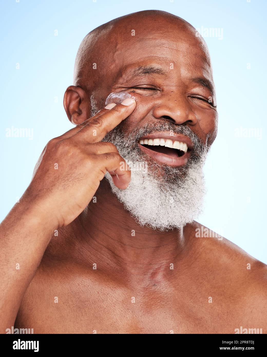 Giving his skin a boost. a handsome mature man posing in studio against ...