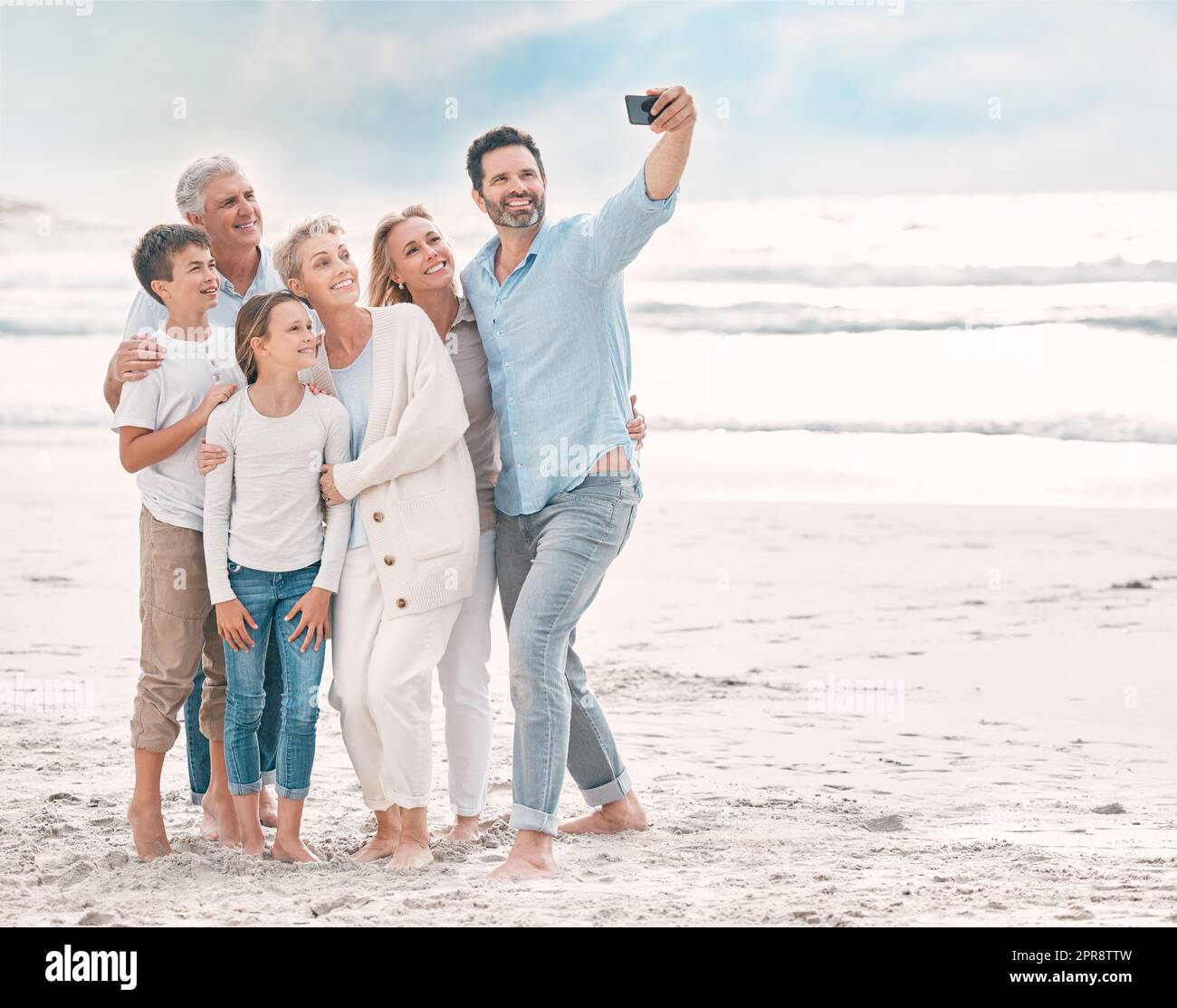 Caucasian female taking photo of family hi-res stock photography and ...