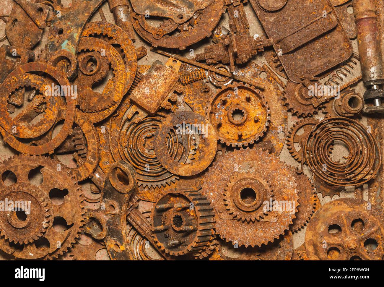 Industrial background. Heap of old rusty parts Stock Photo - Alamy