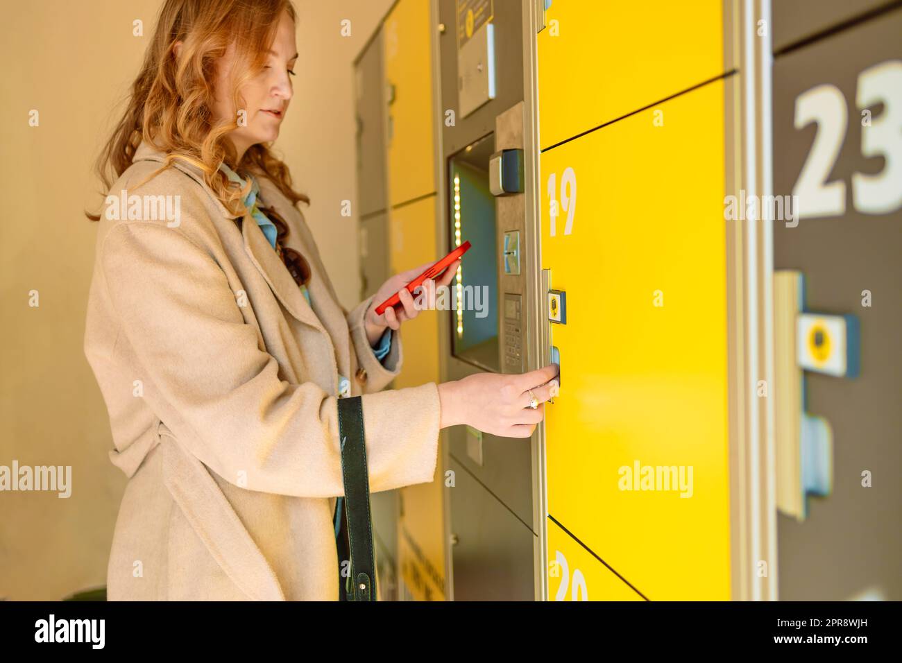 Woman opens locker in hi-res stock photography and images - Alamy