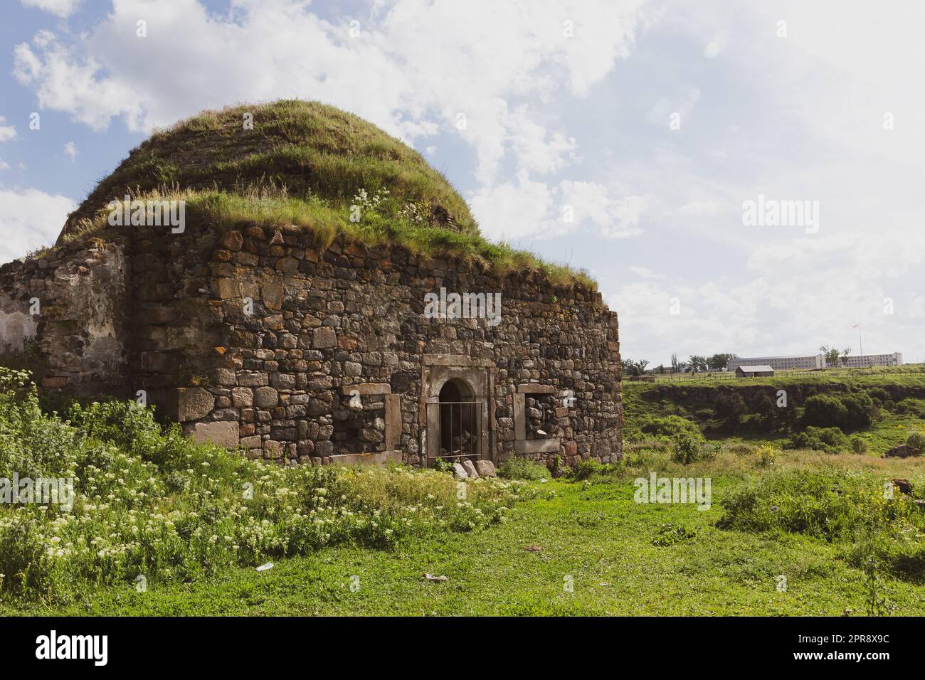 Akhalkalaki castle, ruins of an medieval mosque overgrown with green ...