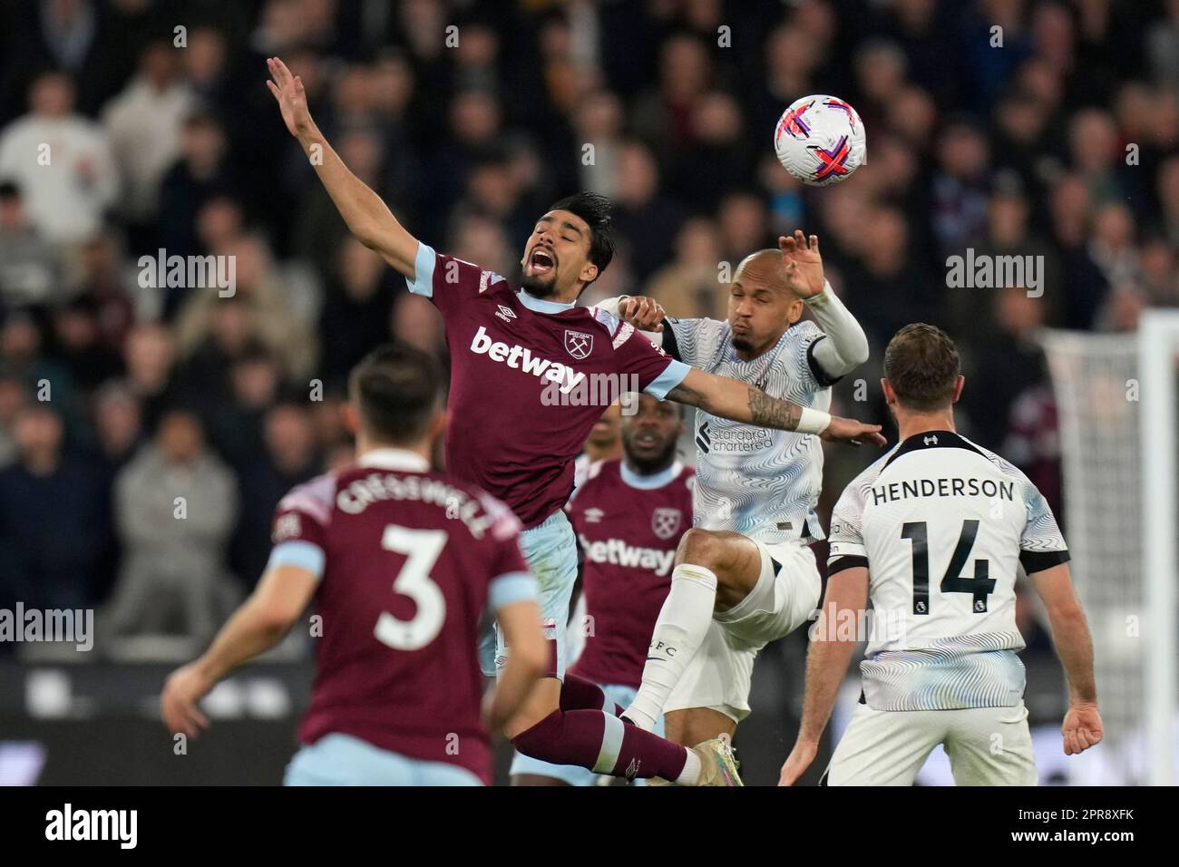 West Ham's Lucas Paqueta, left, jumps for a header with Liverpool's ...