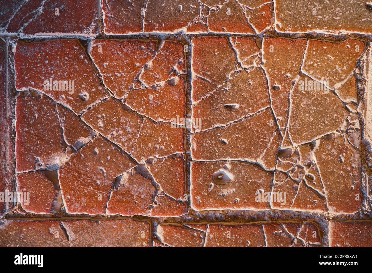 Old stone tiles on the floor of the castle, cracked terracotta tiles ...