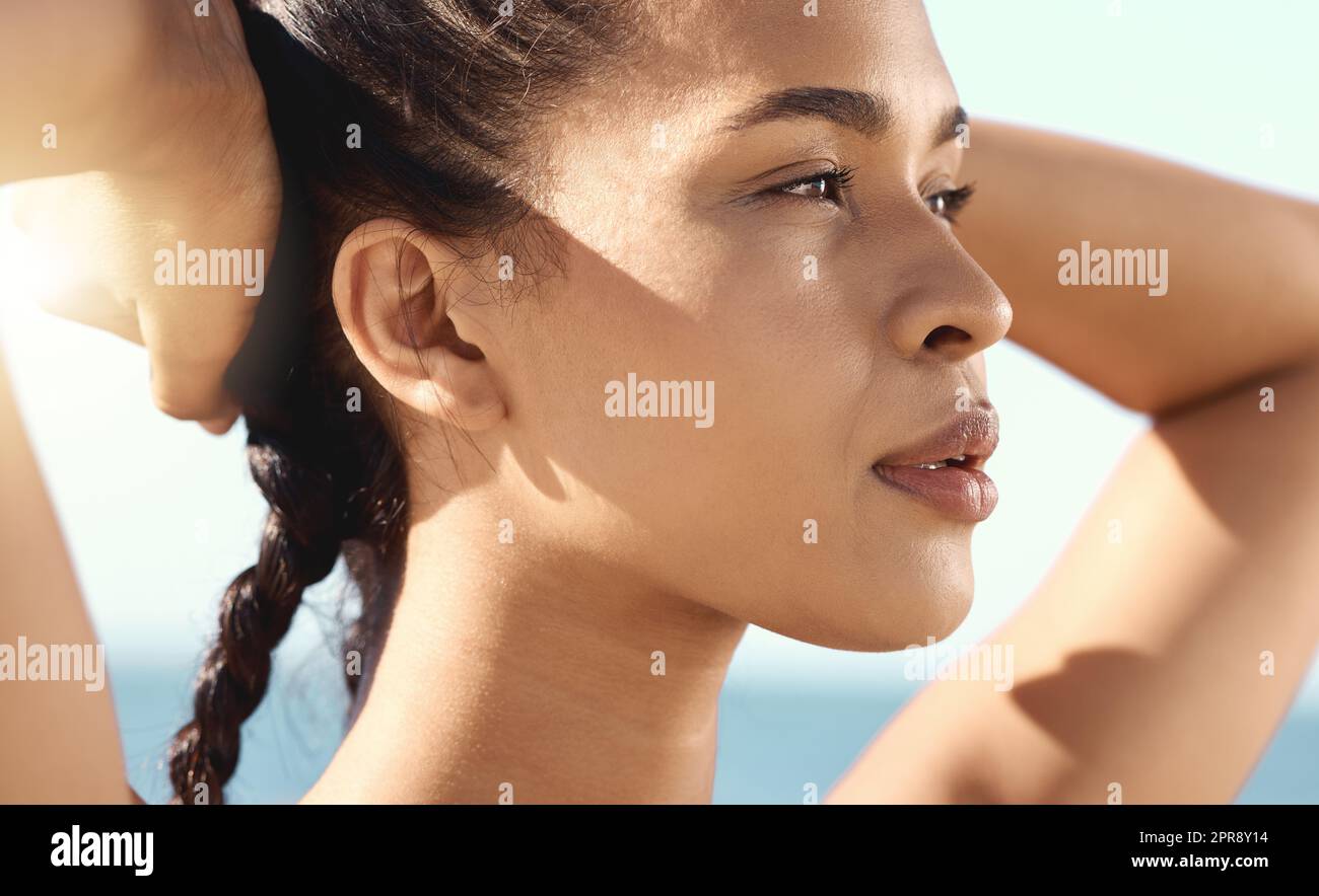 Close up of a beautiful female athletes face while taking a break while ...