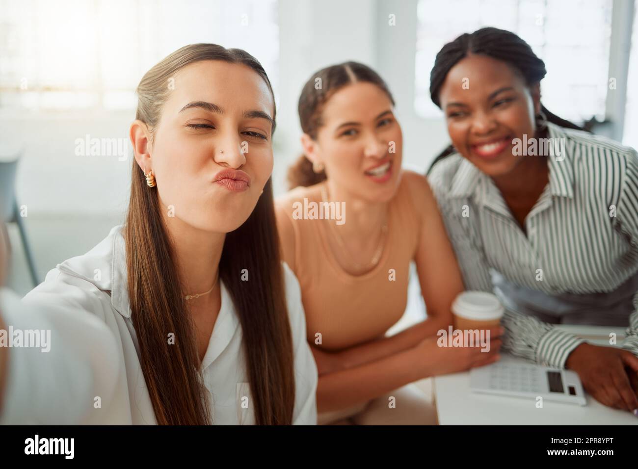 Portrait of a confident young hispanic business woman making a funny ...