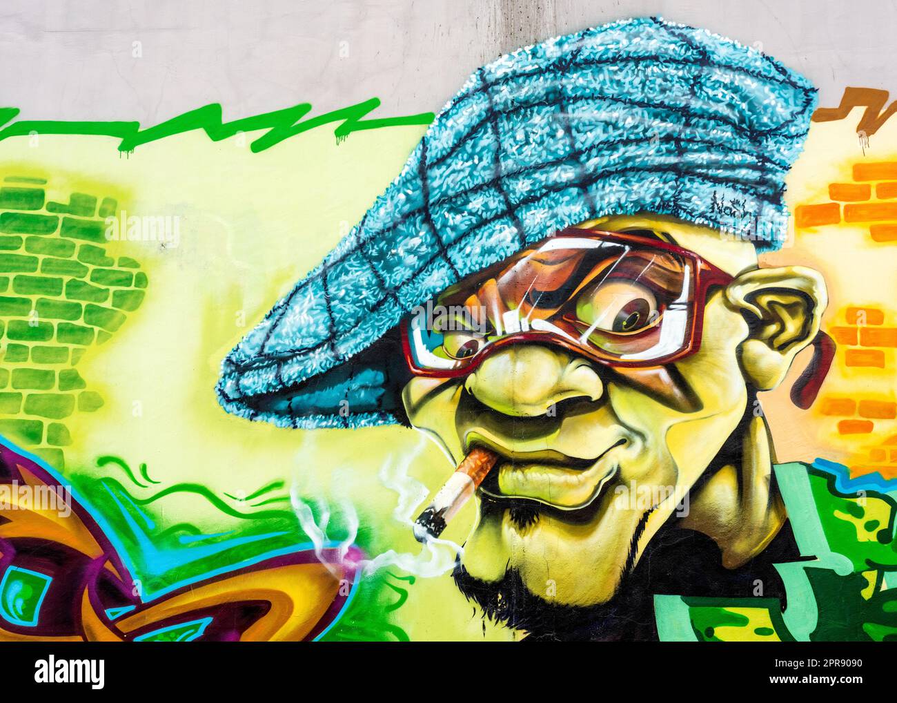 Flamboyant man with beret close up detail graffiti urban street art in ...