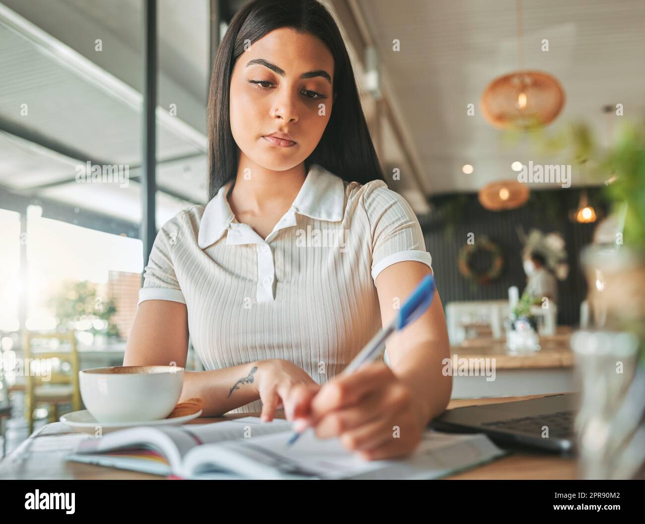 Being a student requires dedication. a young female student working in ...