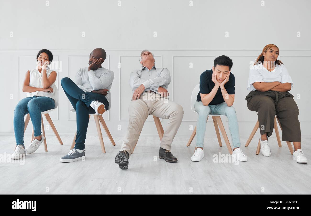 The wait gets more boring with every passing minute. a diverse group of ...