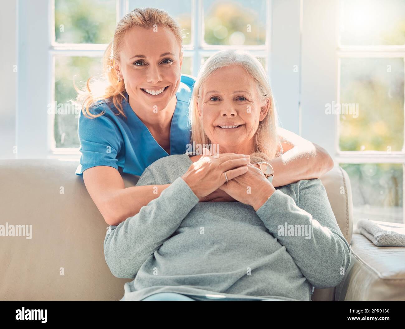Female doctor and nurse hugging hi-res stock photography and images - Alamy