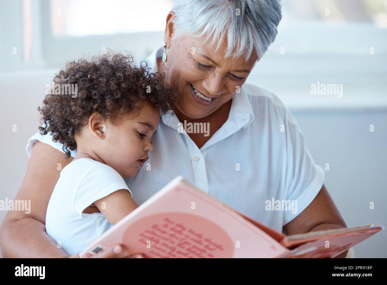 Grandmother child reading hispanic hi-res stock photography and images ...