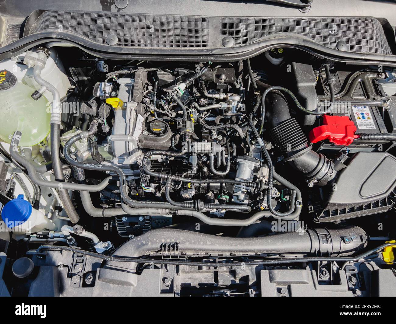 Car engine under an open hood. Close-up Stock Photo - Alamy
