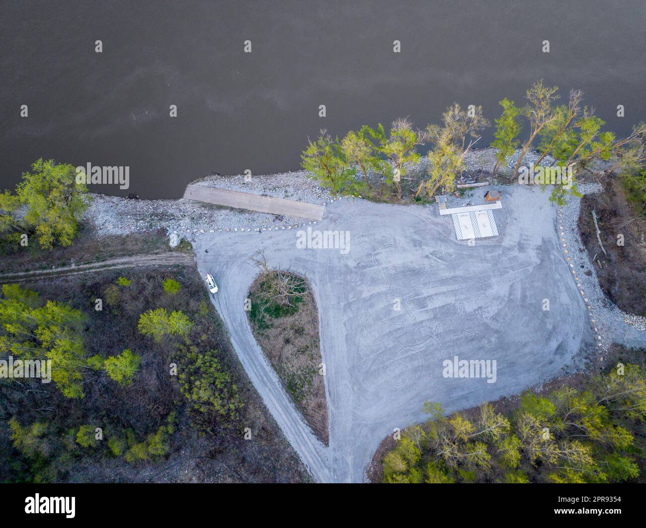 river access with a boat ramp - sunrise aerial view of Missouri River ...