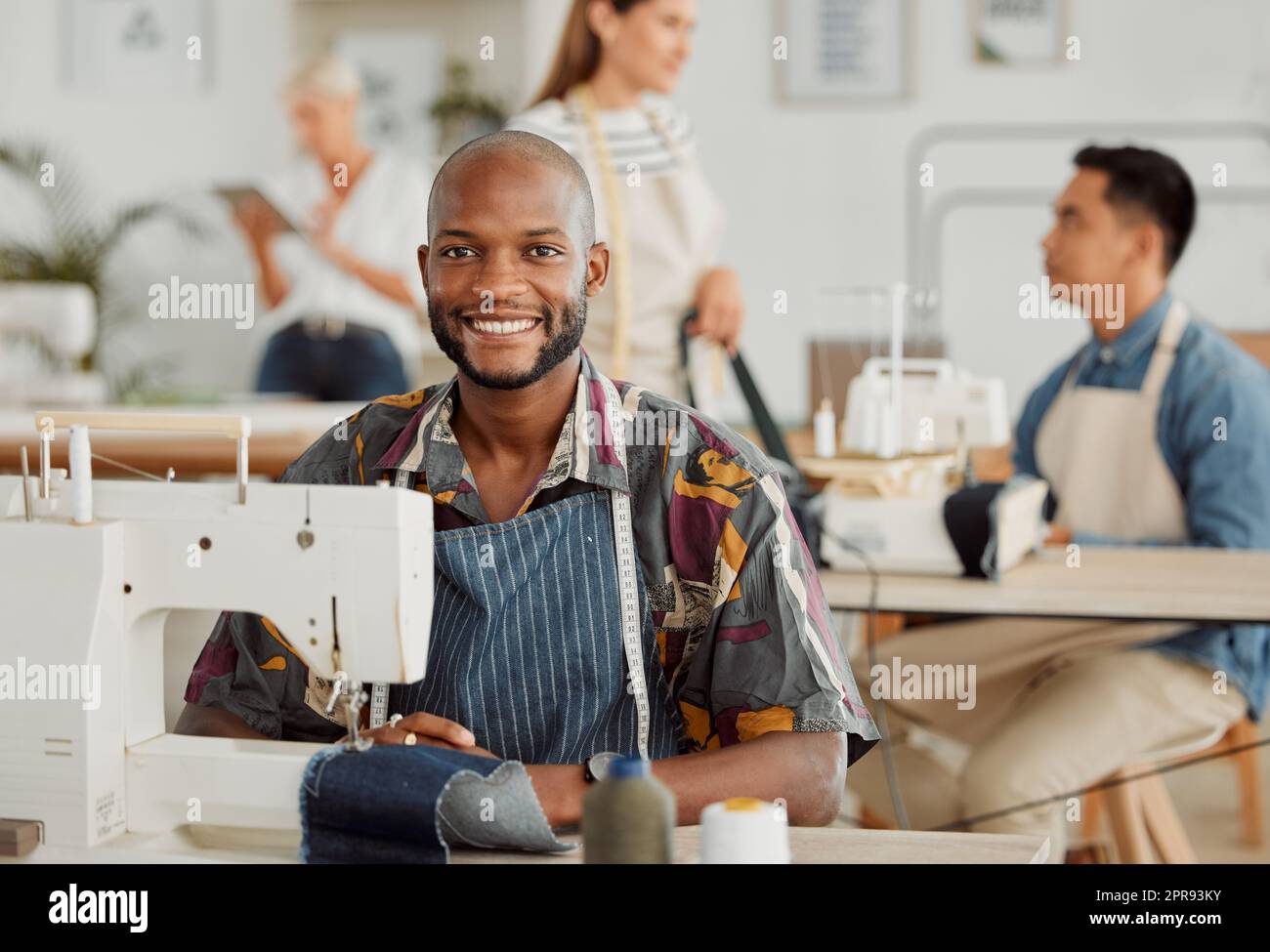 Happy sewing factory worker hi-res stock photography and images - Alamy