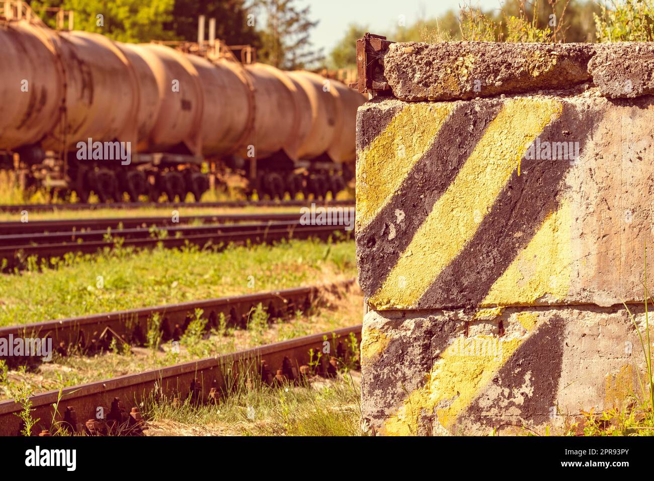 Corner of concrete cargo train platform at depot Stock Photo - Alamy