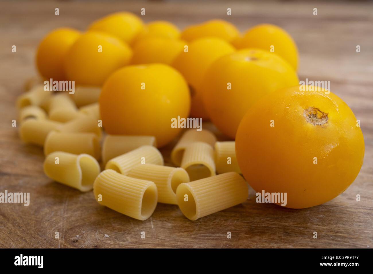 pasta with yellow tomato sauce Stock Photo - Alamy