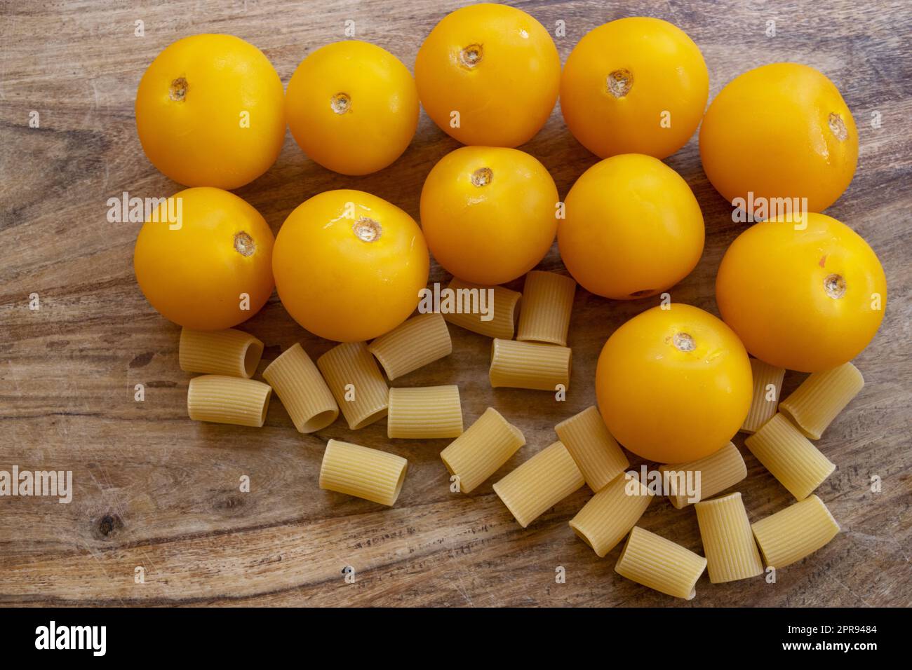 pasta with yellow tomato sauce Stock Photo - Alamy