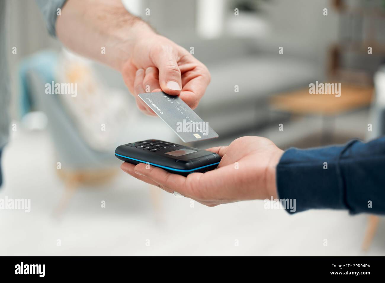 As simple as a tap. Closeup shot of an unrecognizable man paying his ...