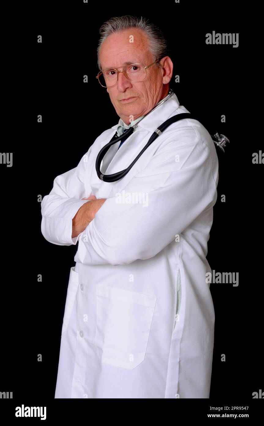 Senior doctor wearing a stethoscope isolated on black Stock Photo - Alamy