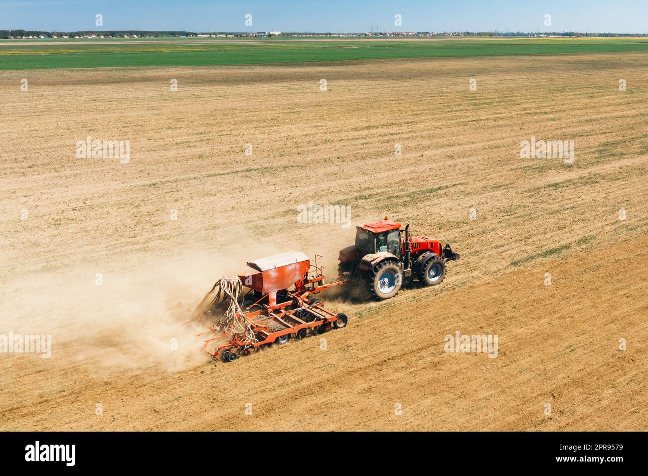 Aerial View. Tractor With Seed Drill Machine Sowing The Seeds For Crops ...