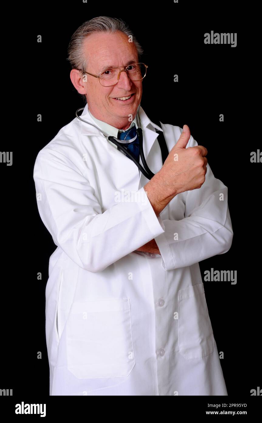 Senior doctor wearing a stethoscope isolated on black Stock Photo - Alamy