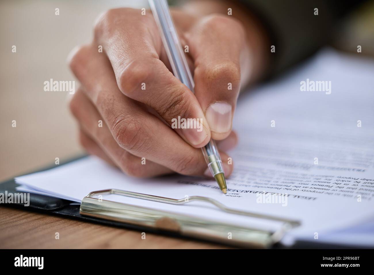 Reading through the offer presented to him. Closeup shot of an ...