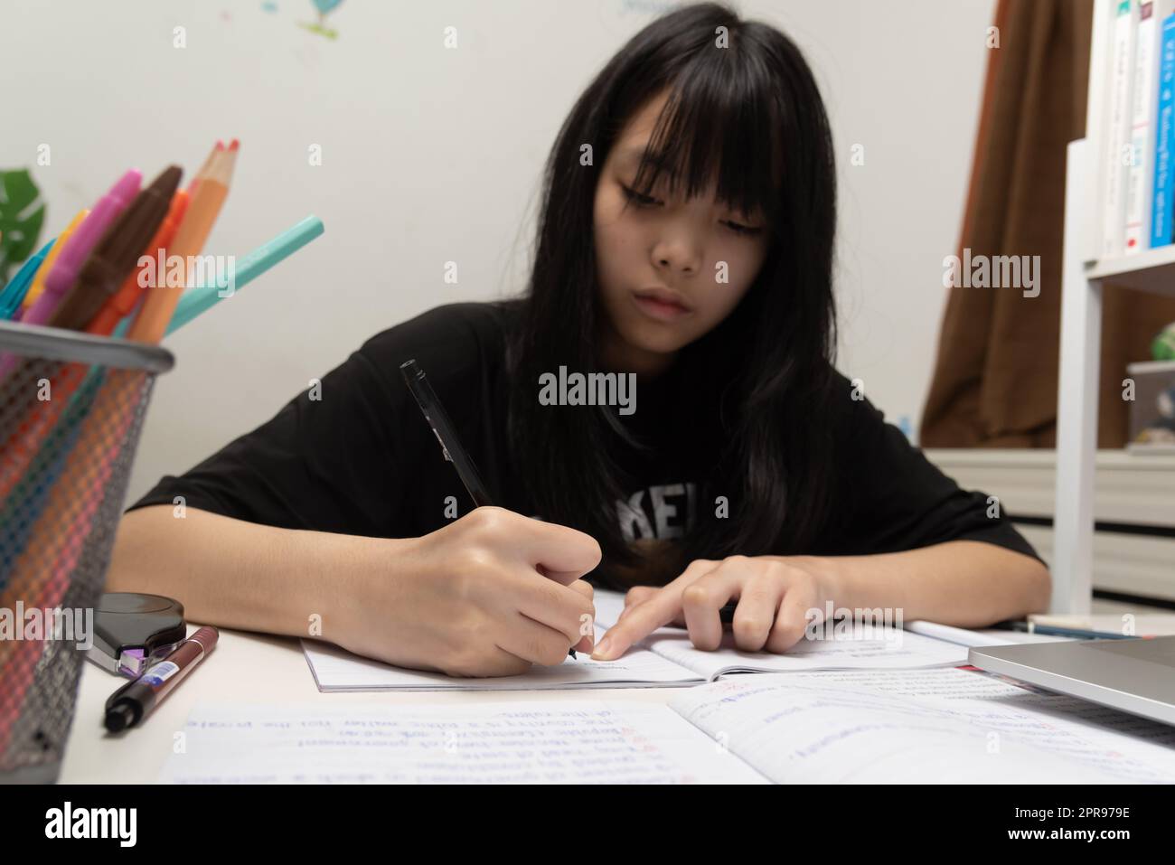 Student writing paper desk hi-res stock photography and images - Alamy