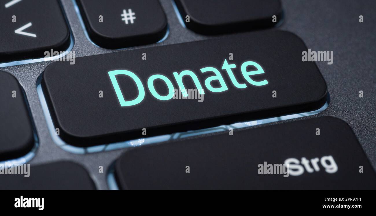 Illuminated keyboard with a labeled key - Donate Stock Photo - Alamy