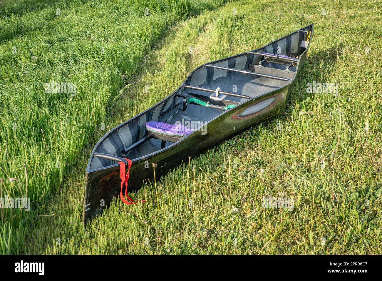 racing tandem canoe, carbon fiber construction, on a grassy area Stock ...