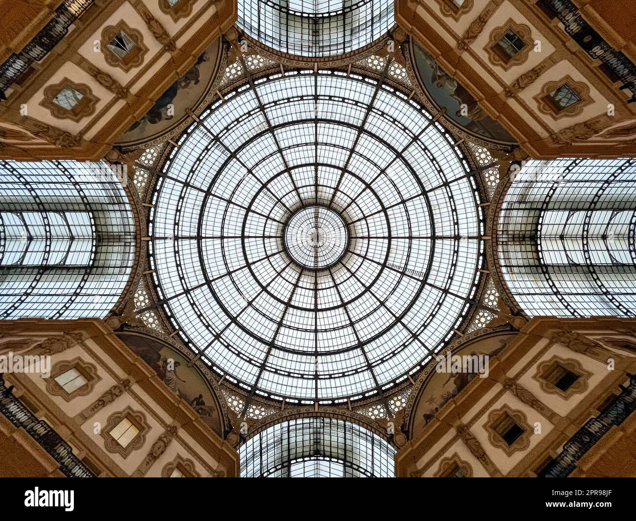 Round stained-glass windows and arches on the ceiling of the Vittorio ...