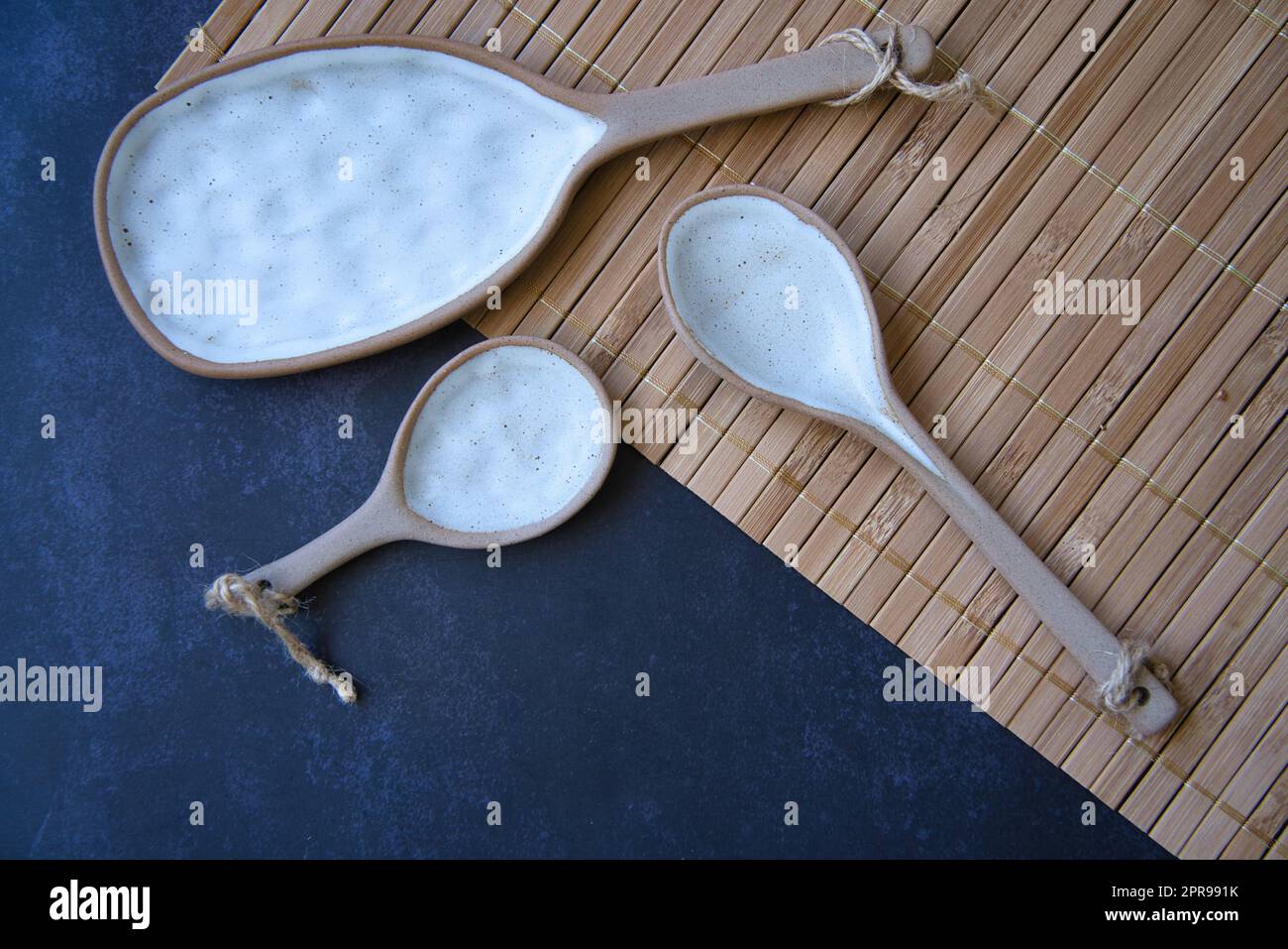 Rustic tableware. Culinary compositions.Ceramic rustic-style spoons ...