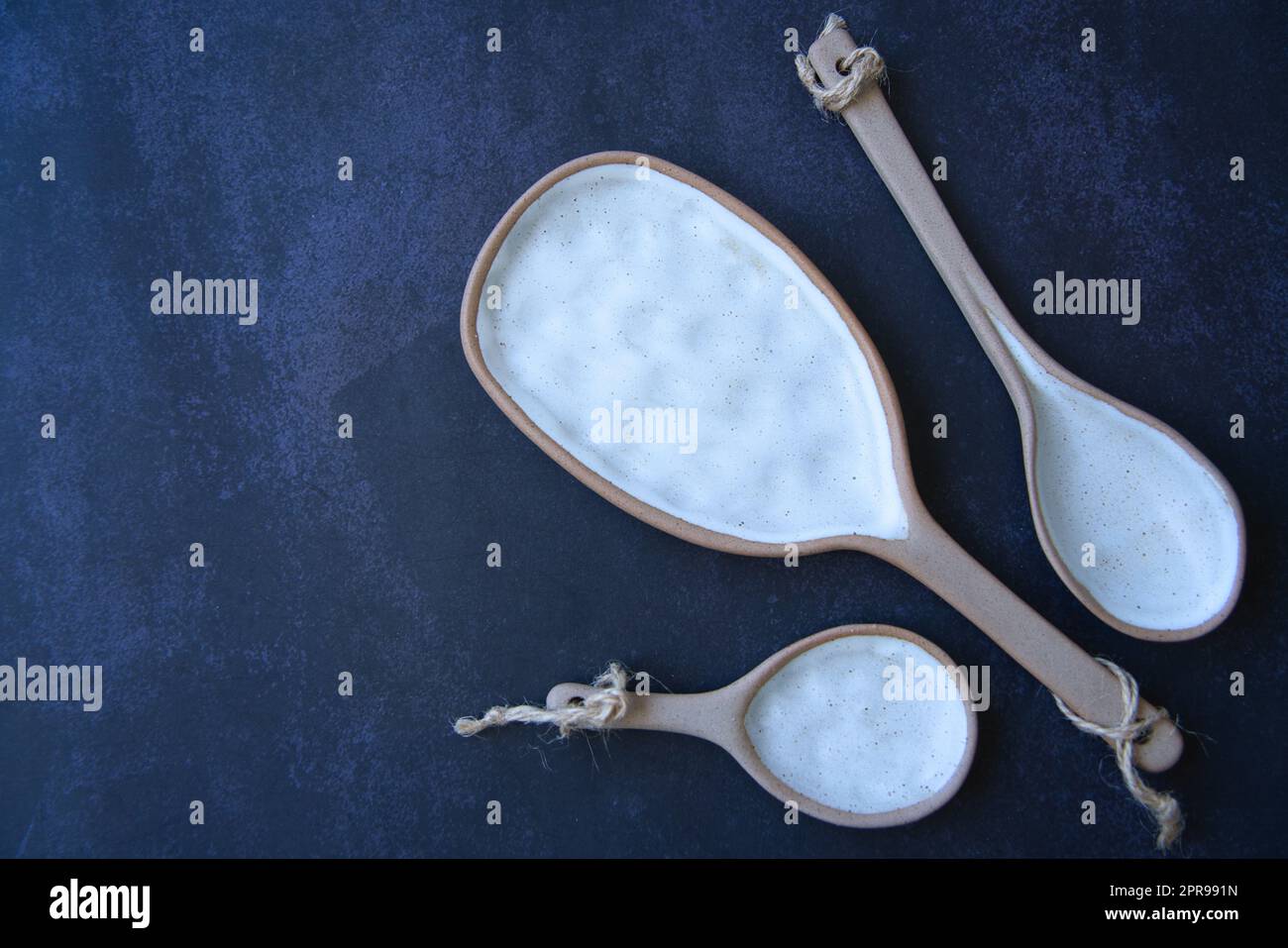 Rustic tableware. Culinary compositions.Ceramic rustic-style spoons ...