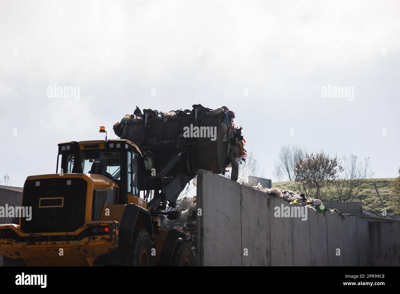 Heavy construction machine, front end loader moving along recycling ...