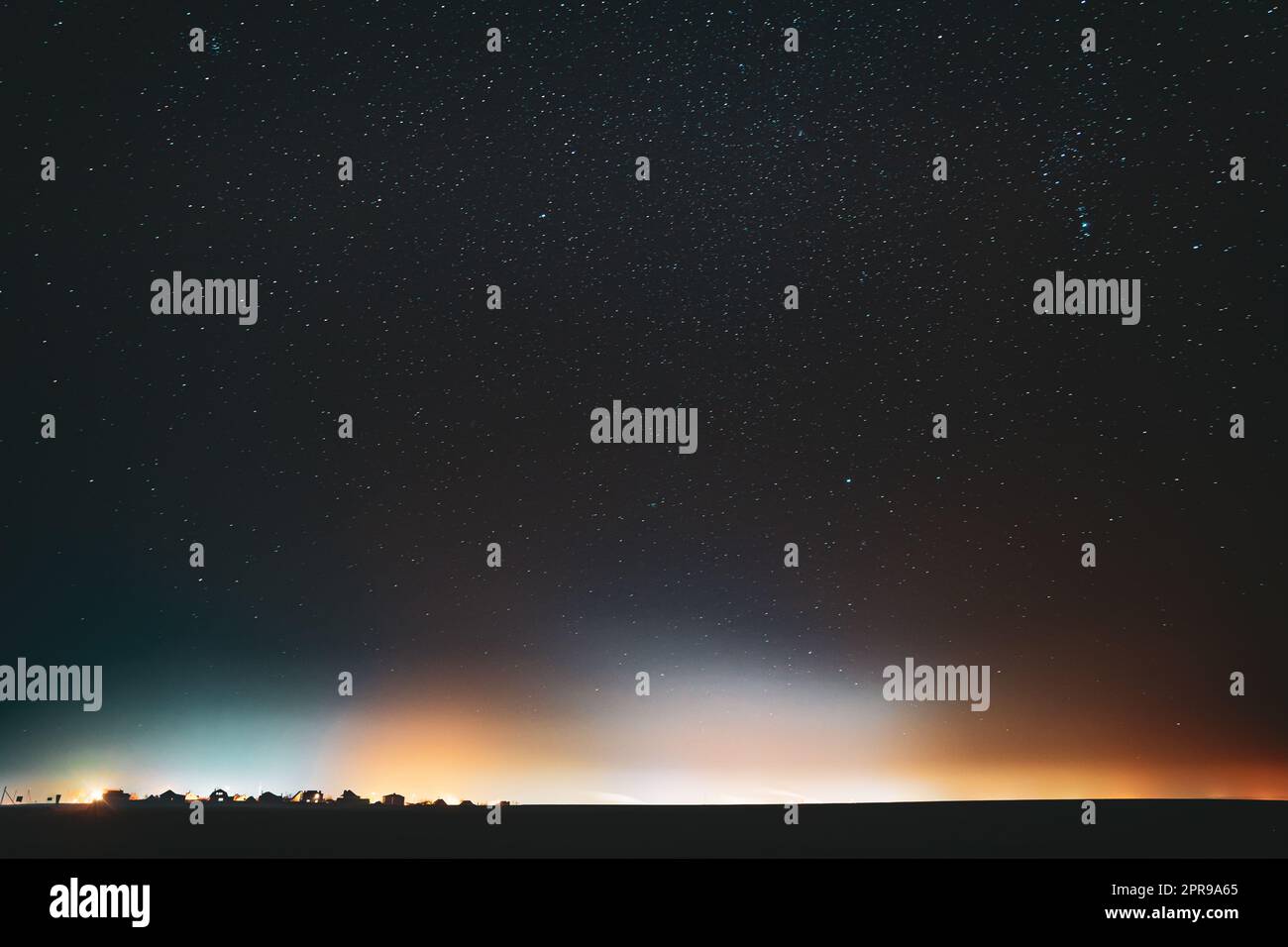 Night Starry Sky With Glowing Stars Above Countryside Town Landscape ...