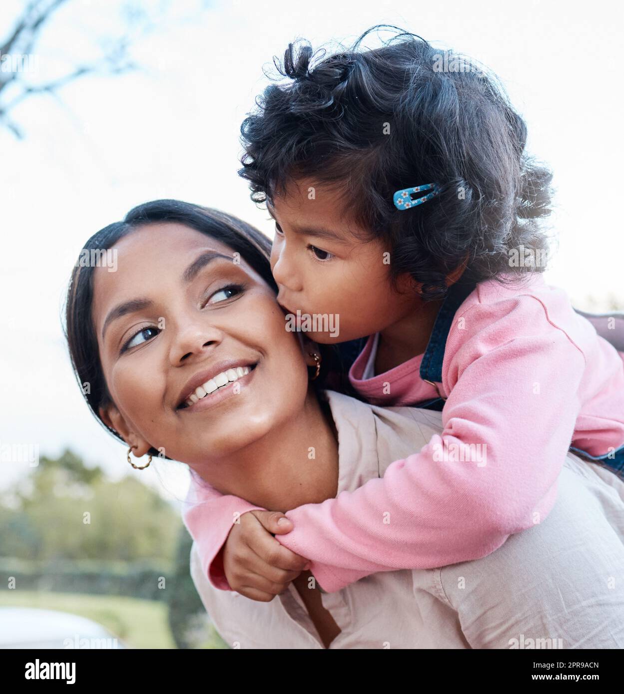 Woman carrying her child on her back hi-res stock photography and ...